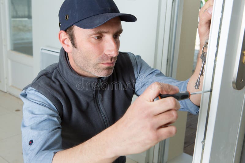 Man Using Screwdriver To Adjust Door Hinge Stock Image - Image of latch ...
