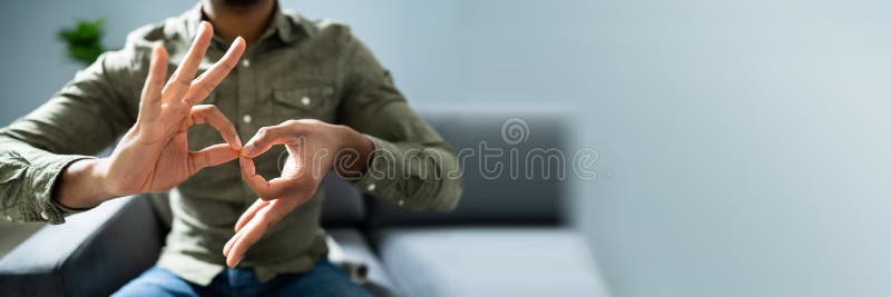 Man Using Sign Language To Communicate Against Stock Image - Image of ...