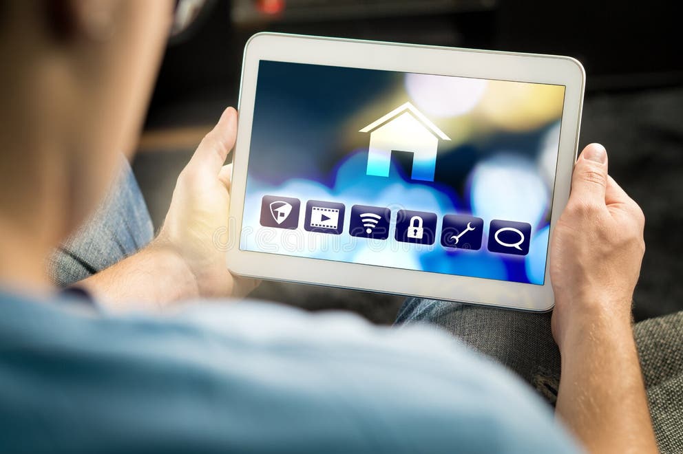 Man Using Smart Home Application in Tablet To Control House Stock Image ...