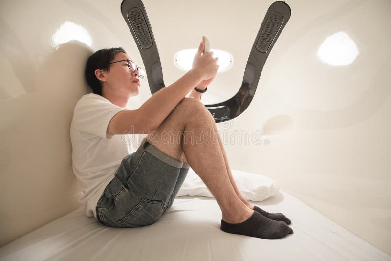 Man in capsule hotel stock image. Image of korean, mirror - 168126481