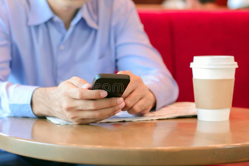 A Man Using Smart Phone in Coffee Shop Stock Photo - Image of ...
