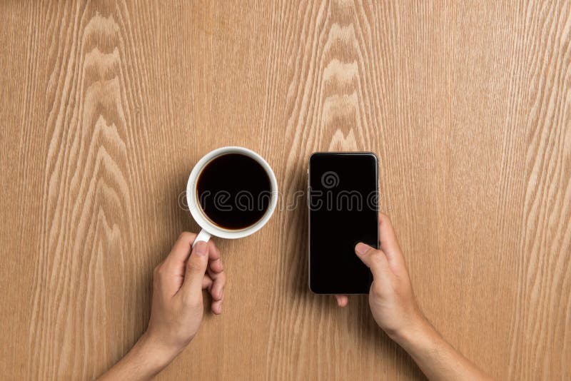 Man Using Smart Phone Sitting on Table, Hand Holding Smart Phone Stock ... Man Using Smart Phone Sitting on Table, Hand Holding Smart Phone Stock ...