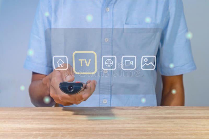 A Man Using a Smart TV Remote To Change and Control the Entertainment ...