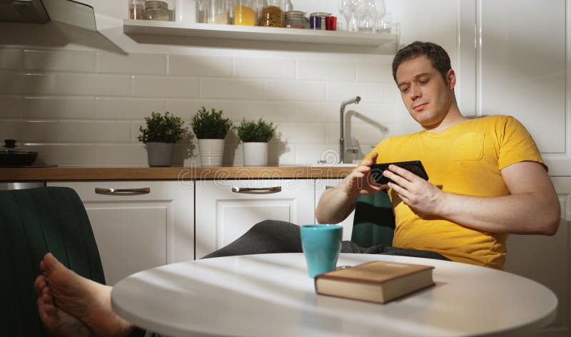 Man using a smartphone stock photo. Image of media, home - 213897656