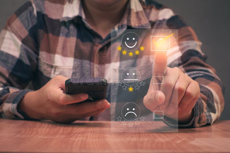 Man is Using a Smartphone and he is Pressing Face Emoticon Smile Stock ...