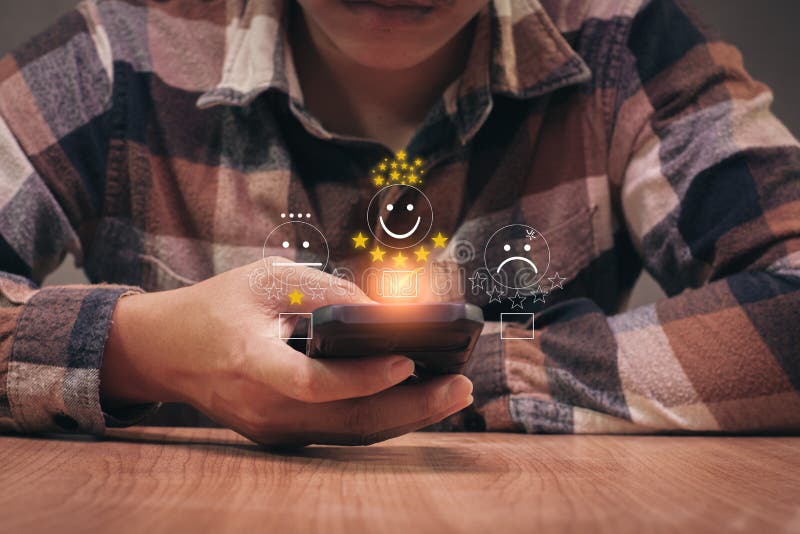 Man is Using a Smartphone and he is Pressing Face Emoticon Smile Stock ...