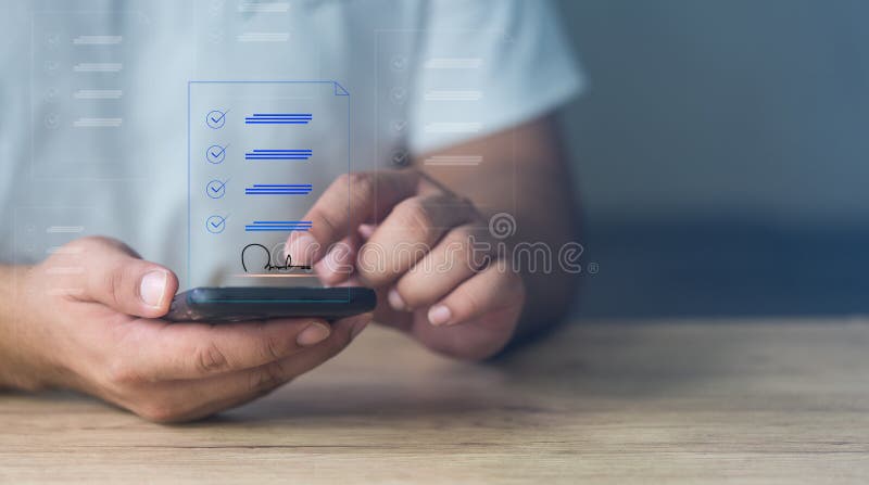 Man Using a Smartphone Signing Electronic Documents on Digital ...