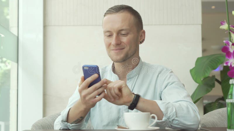 Man Using Smartphone and Smiling Stock Image - Image of smartphone ...