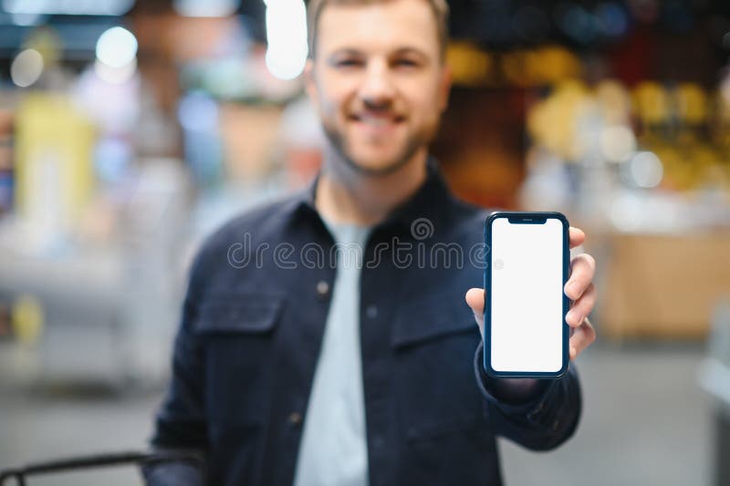 Man Using Smartphone in Supermarket. Stock Image - Image of blank, hold ...