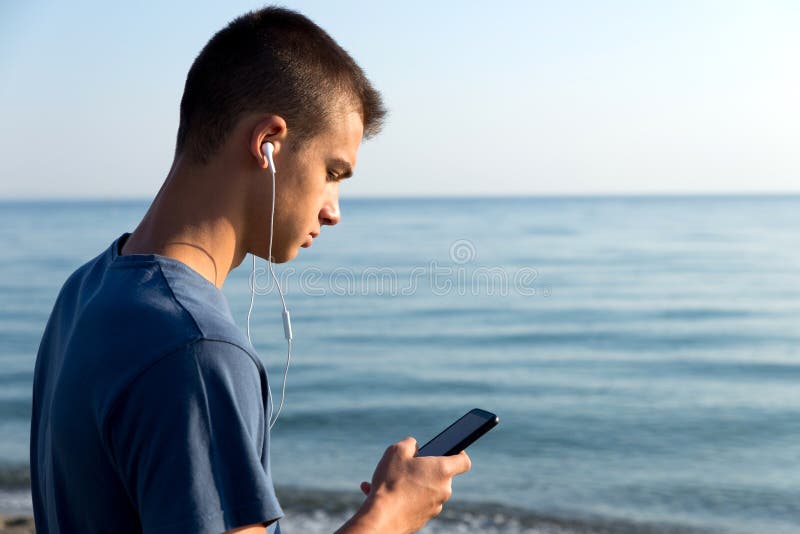 Young Man Listen To Music on Smartphone Stock Photo - Image of mobile ...