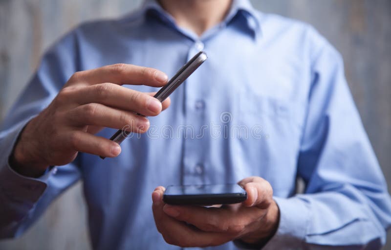 Man Holding Smartphones. New Product. Business. Development Stock Photo ...
