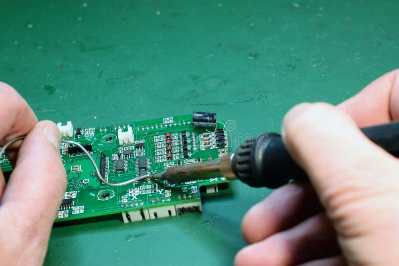 Man Using Soldering Iron To Repair Circuit Board Stock Image - Image of ...