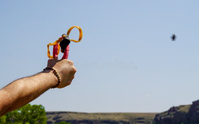 Man Using Spear Thrower Throwing Rock Nature Amusement Stock Photo ...