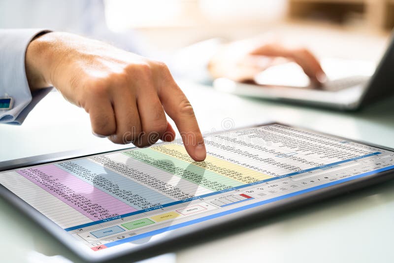 Man Using Spreadsheet Data stock photo. Image of electronics - 253077070