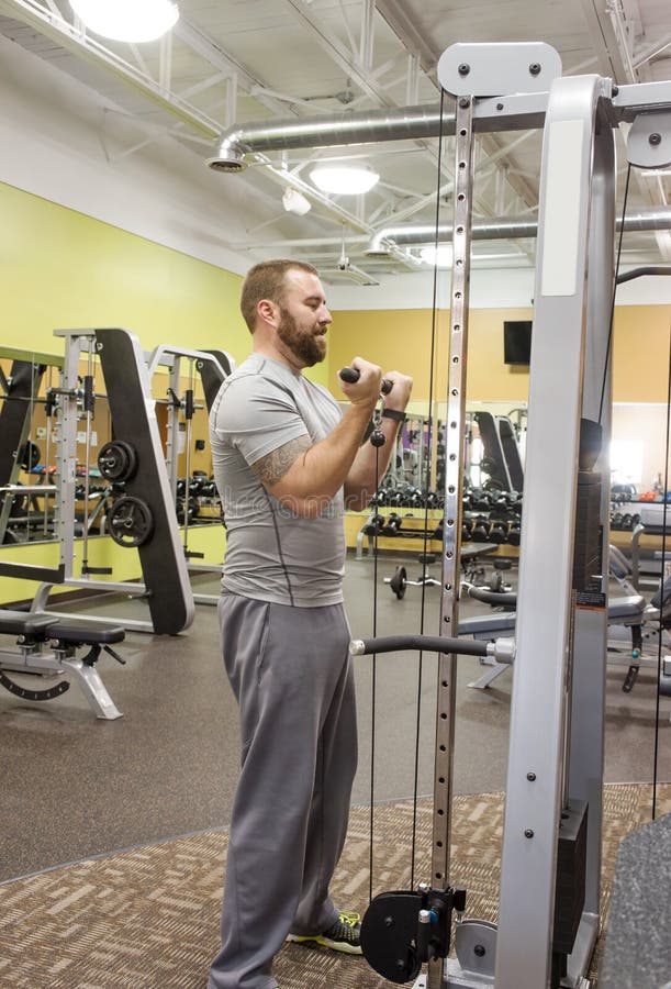 Man Using Straight Bar Cable Pull Stock Photo - Image of active ...