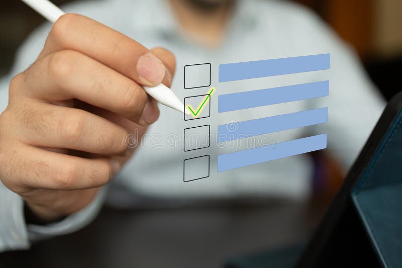 Man Using Stylus To Check Digital Box on Interactive List Over Modern ...