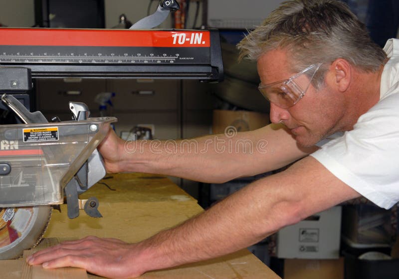 Man using table saw stock photo. Image of middle, work - 13678440