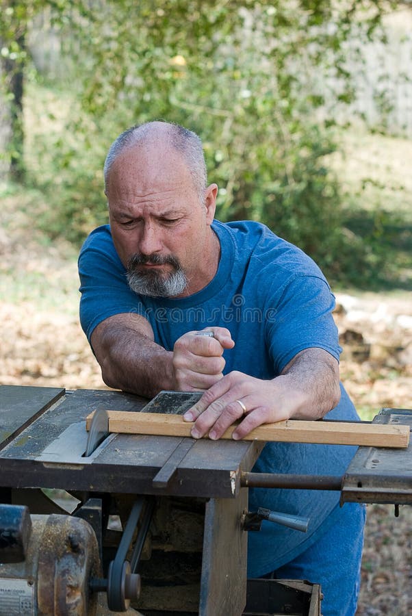 Man using tablesaw stock photo. Image of power, build - 4555044