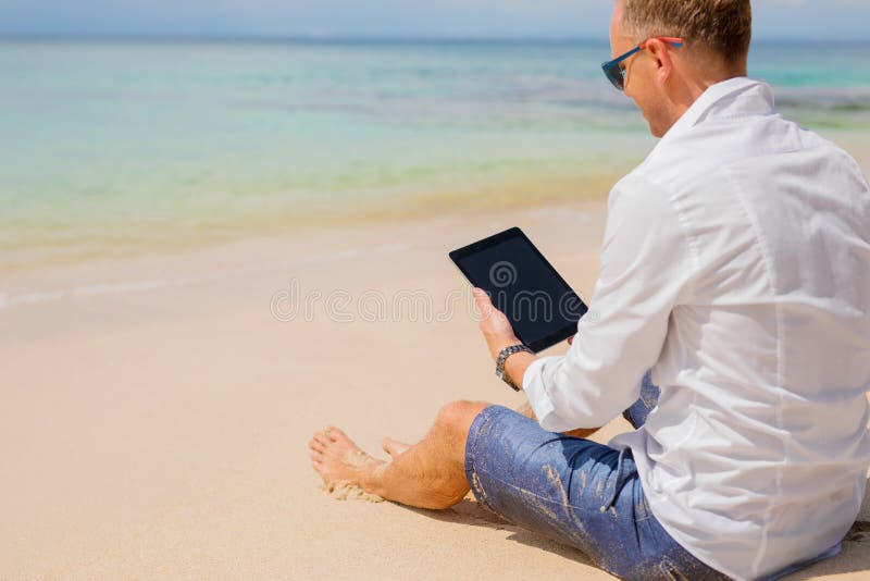 Man with Tablet on the Beach Stock Photo - Image of relax, beach: 114549684