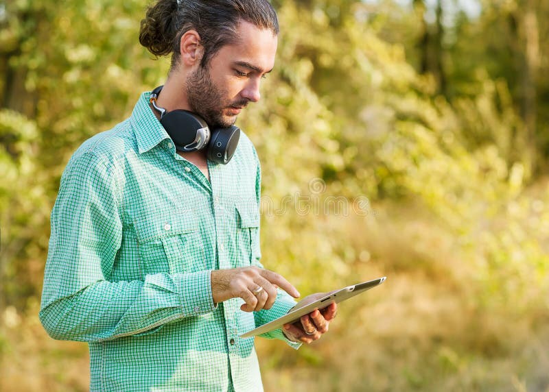 Man Using a Tablet Computer while Relaxing Stock Image - Image of ...
