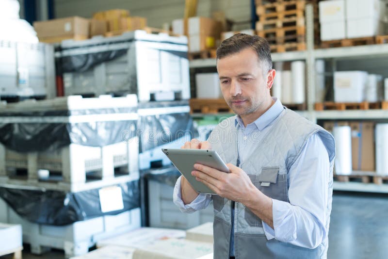 Man Using Tablet at Factory Stock Image - Image of globalbusiness ...