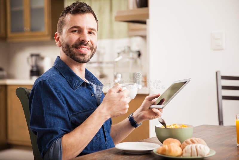 Man using a tablet at home stock photo. Image of happy - 62896896