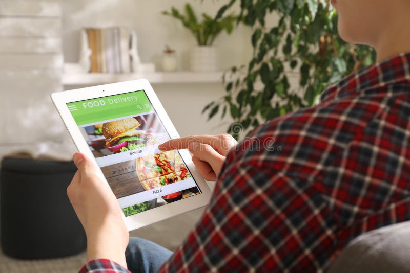 Man Using Tablet for Ordering Food Online at Home. Delivery Service ...