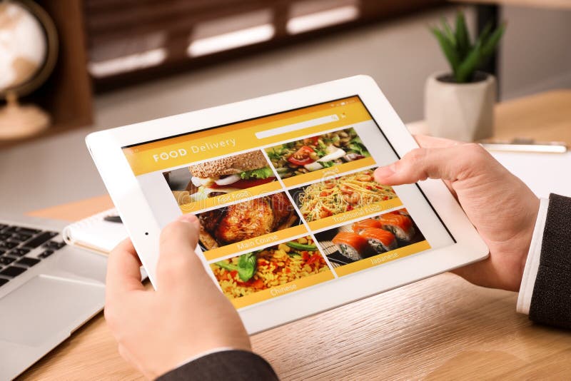 Man Using Tablet for Ordering Food Online at Work, Closeup. Concept of ...