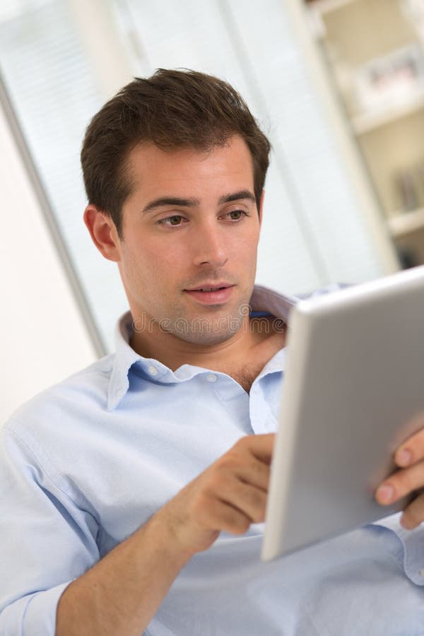 Man using tablet pc indoor stock image. Image of looking - 33172569