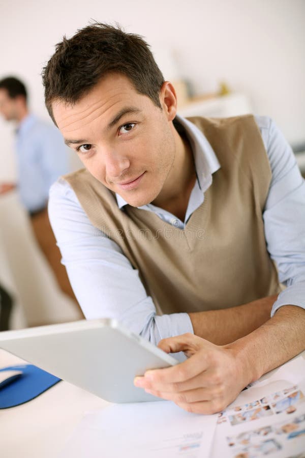 Man using tablet at work stock photo. Image of people - 31545806