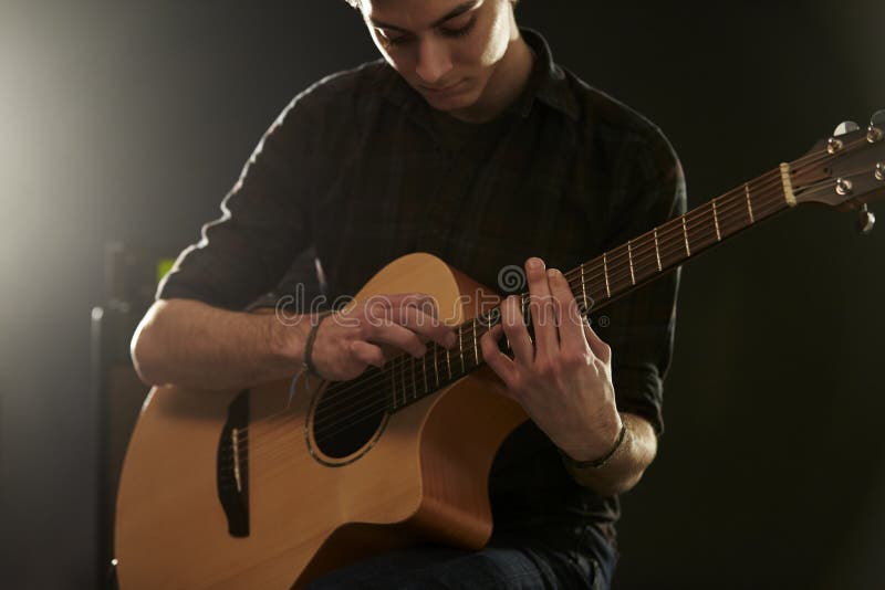 Man Using Tapping Technique on Acoustic Guitar Stock Photo - Image of ...