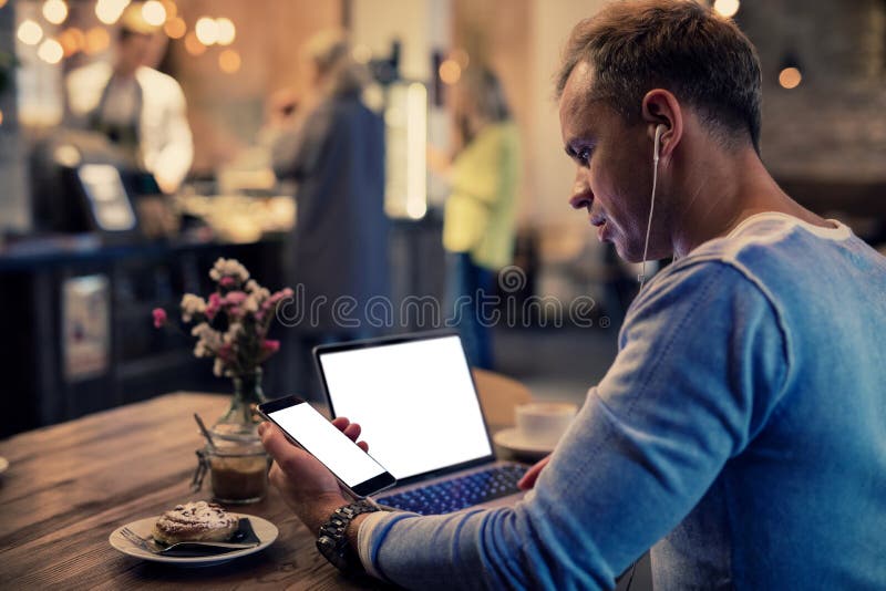 Man Using Tech Gadgets in Cafe Stock Image - Image of coder, blank ...
