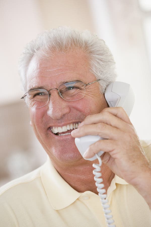 Man Using Telephone and Smiling Stock Photo - Image of retired ...