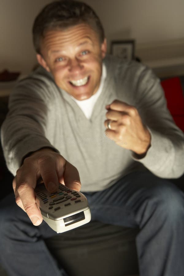 Man Using Television Remote Control Stock Photo - Image of excitement ...