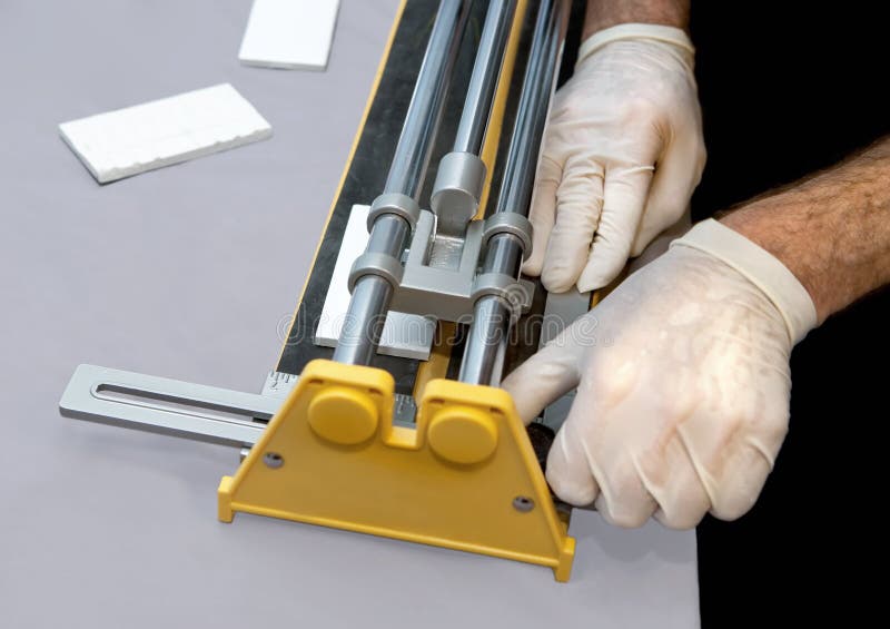 Man Using Tile Cutter stock photo. Image of household - 11572760