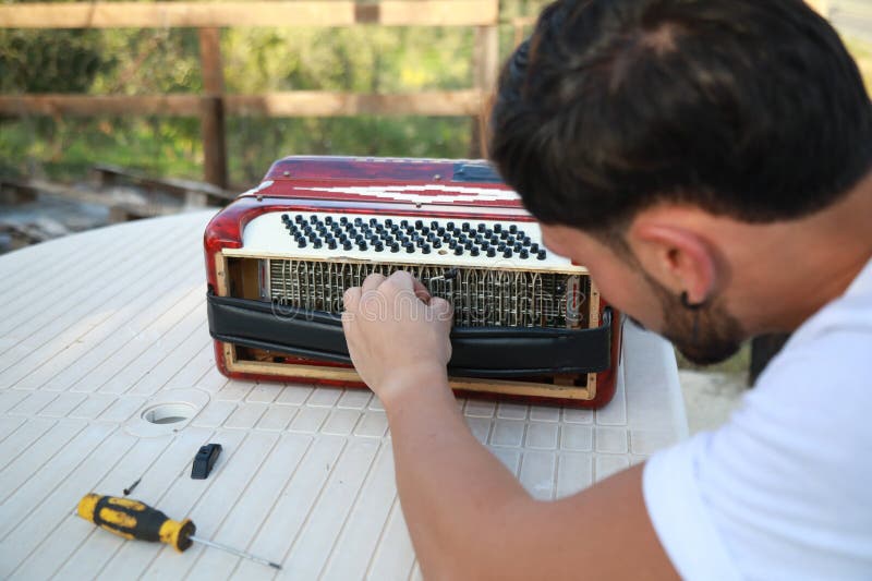 Man Using Tool To Fix and Tune Accordion Stock Image - Image of play ...