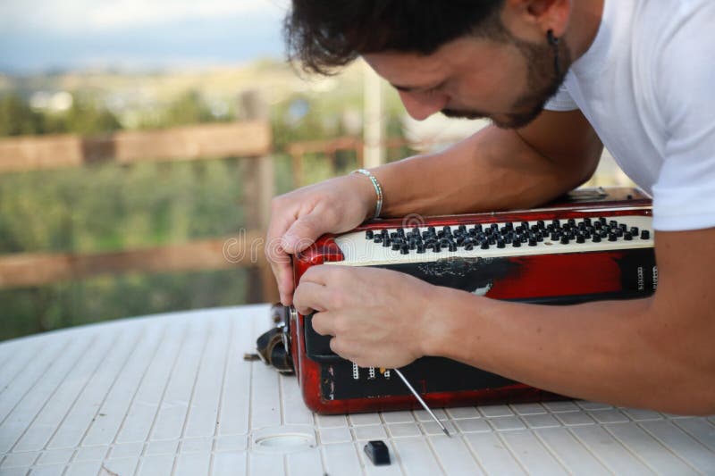 Man Using Tool To Fix and Tune Accordion Stock Image - Image of ...