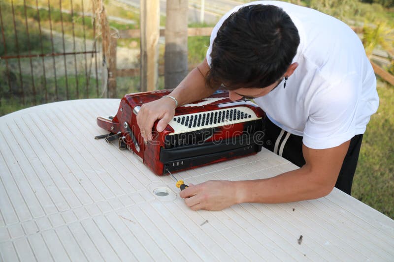 Man Using Tool To Fix and Tune Accordion Stock Image - Image of ...