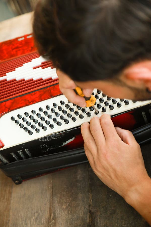 Man Using Tool To Fix and Tune Accordion Stock Image - Image of tuning ...