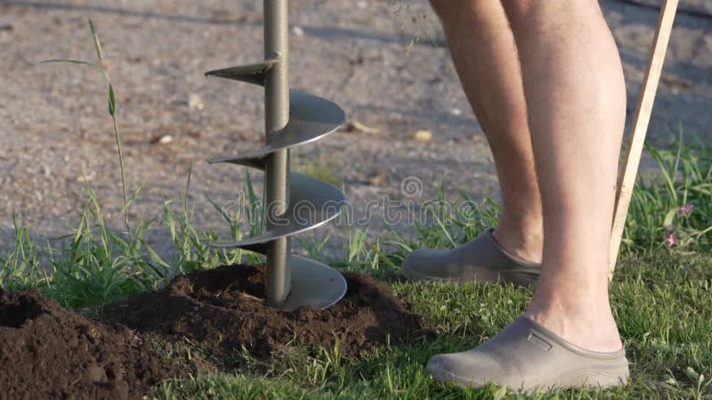 Man Using Tools Hand-held Portable Manual Earth Auger for Prepare the ...