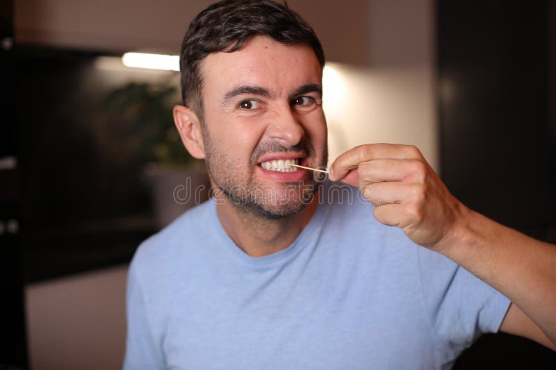 Man Using a Toothpick after Lunch Stock Photo - Image of food, dental ...