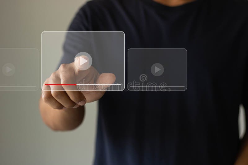 Man Using Touching the Play Button on a Virtual Screen for Streaming ...