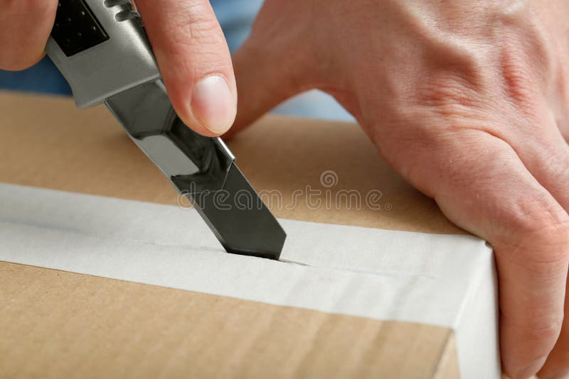 Man Using Utility Knife To Open Parcel, Closeup Stock Image - Image of ...