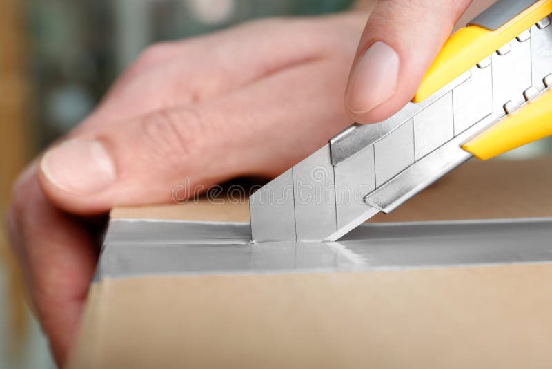 Man Using Utility Knife To Open Parcel, Closeup Stock Image - Image of ...