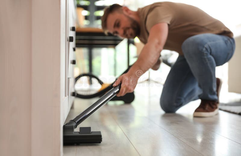 Young Man Using Vacuum Cleaner at Home Stock Photo - Image of hygiene ...