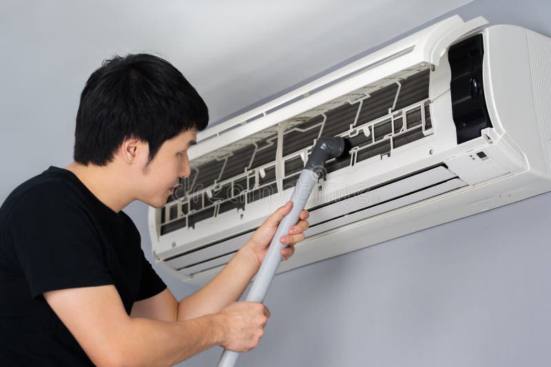 Man Using Vacuum Cleaner Cleaning Air Conditioner Home Stock Photos ...