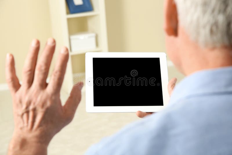 Man Using Video Chat on Tablet at Home, Closeup Stock Image - Image of ...