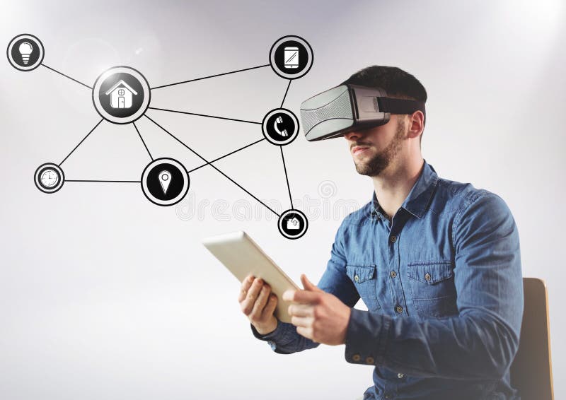 Man Using Virtual Reality Headset and Digital Tablet and Networking ...