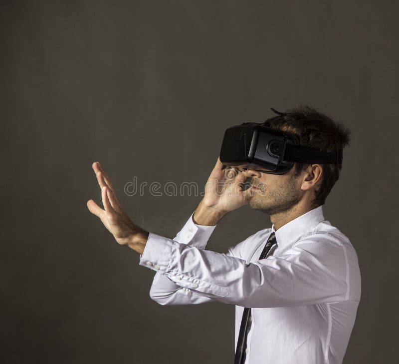 Man Using Virtual Reality Headset Stock Photo - Image of reality ... Man Using Virtual Reality Headset Stock Photo - Image of reality ...