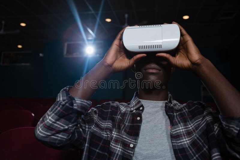 Man Using Virtual Reality Headset while Watching Movie Stock Photo ... Man Using Virtual Reality Headset while Watching Movie Stock Photo ...